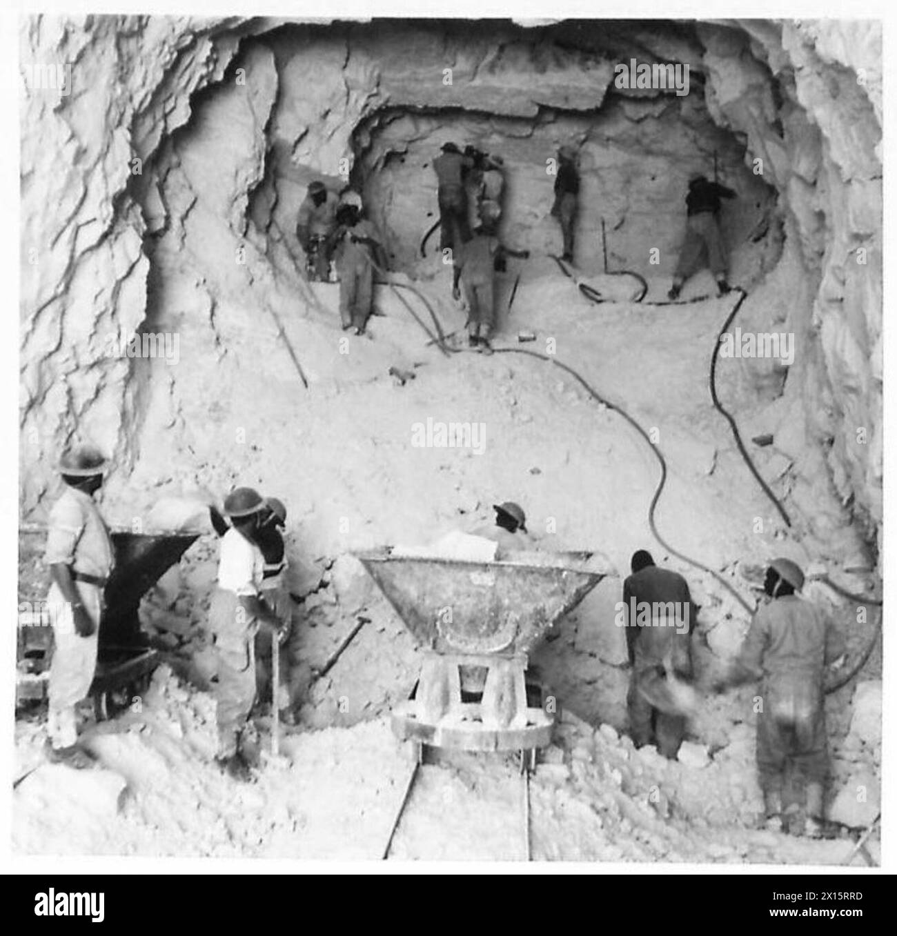 Basutos work on the Haifa-Tripoli railway, drilling through rock and ...