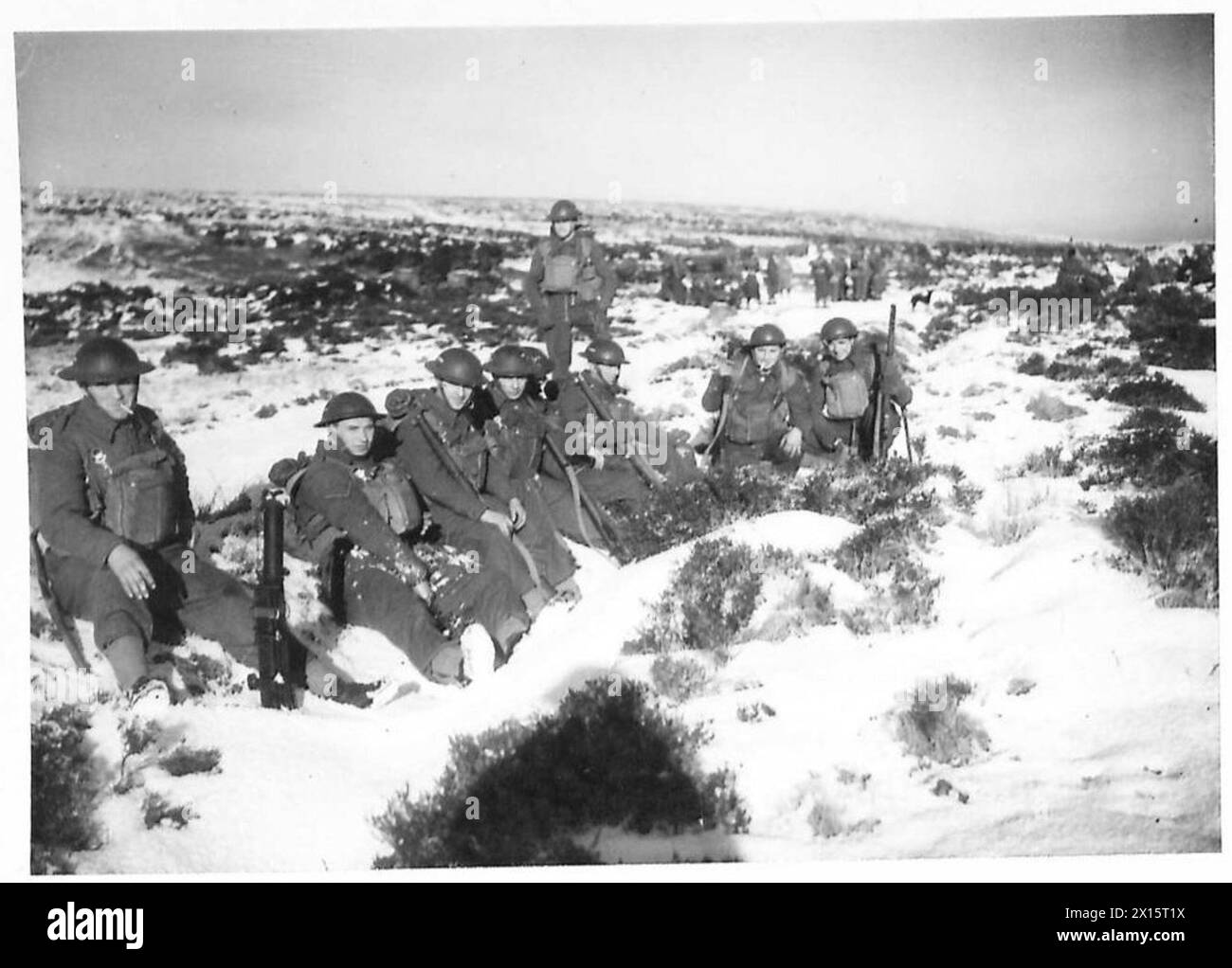 BRITAIN'S ARMY TRAINS UNDER ACTUAL SHELL FIRE - Troops halted in the ...