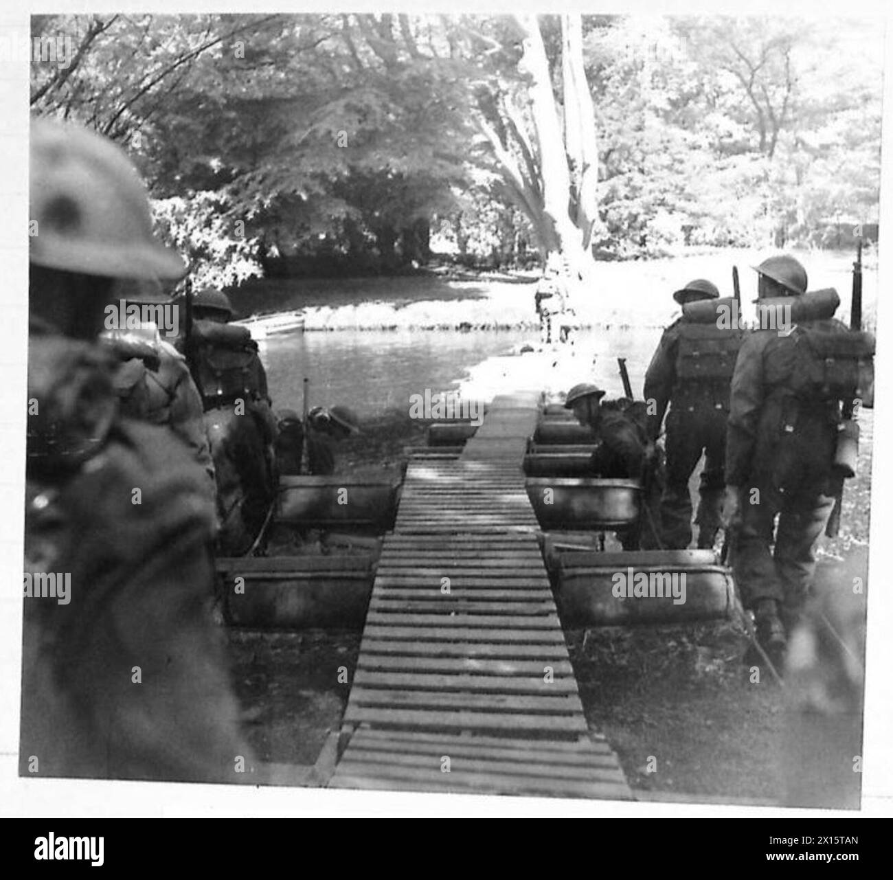 Royal Scots soldiers of the 52nd Division launch a Kapok bridge across ...