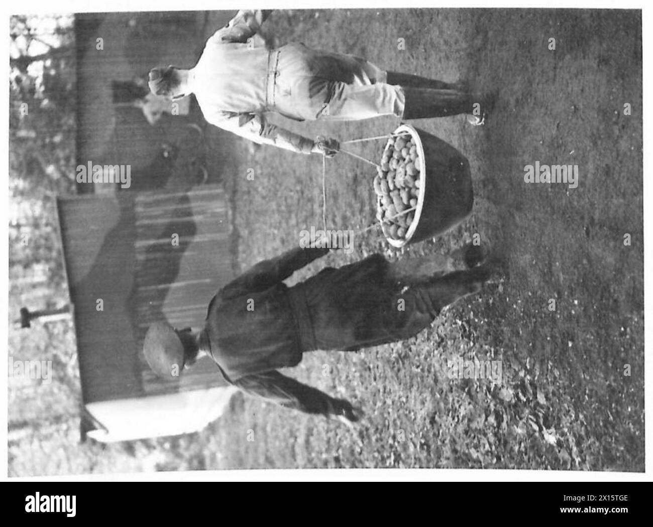 DUDS FOR SPUDS - A portion of a German parachute mine container being ...