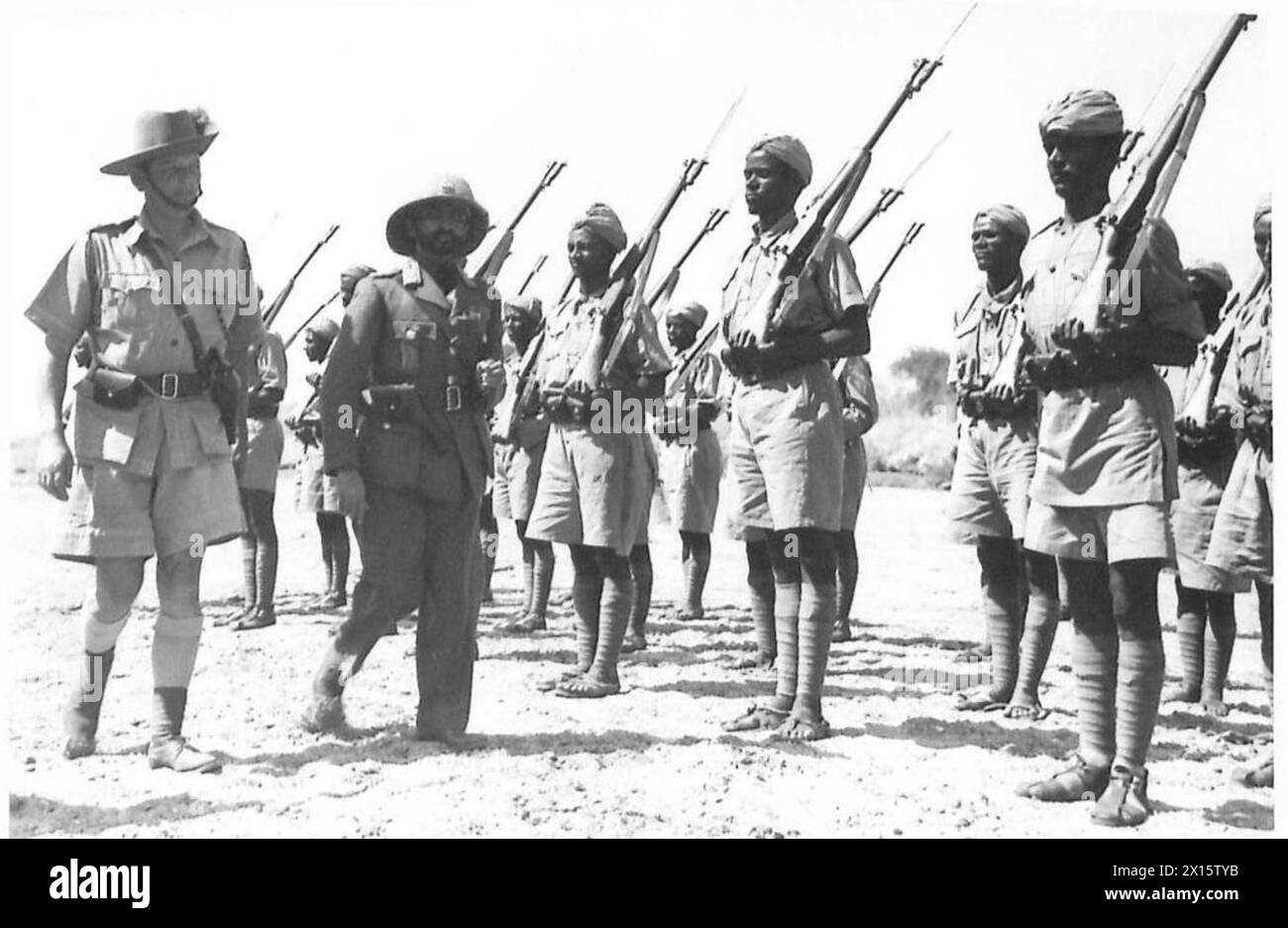 The Emperor Negus inspects his troops and unfurls the standard during a ...