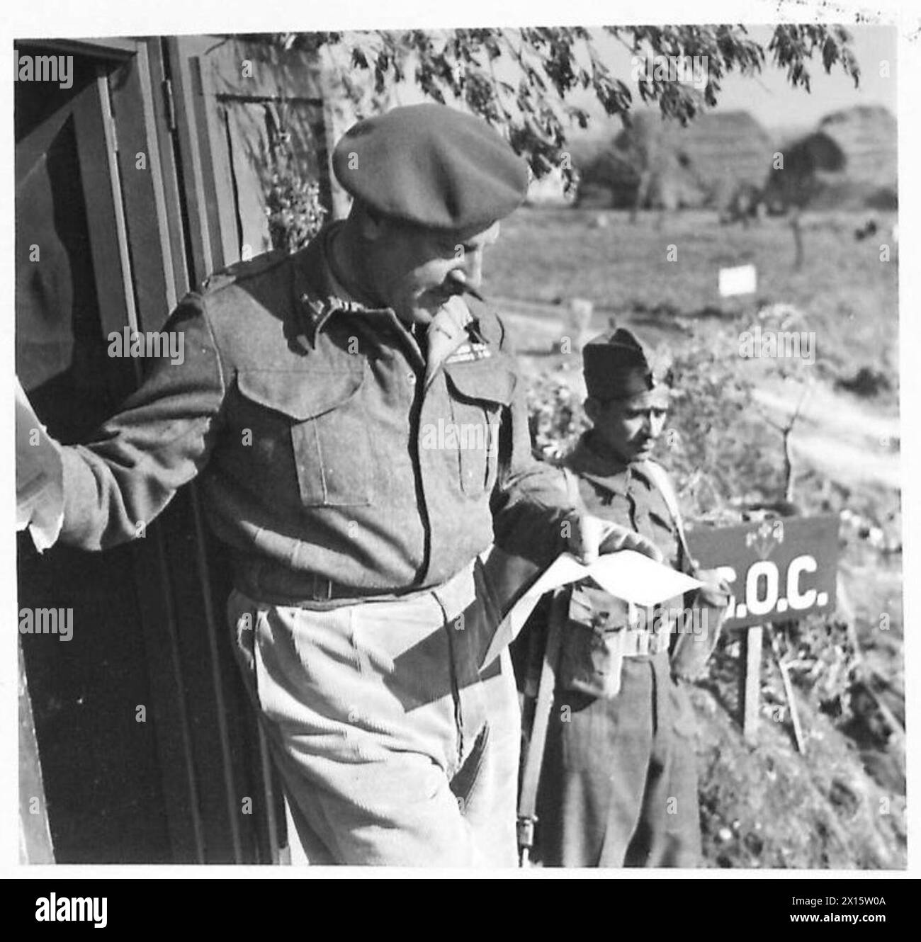 Major General Russell reads a message on the steps of his caravan Stock ...