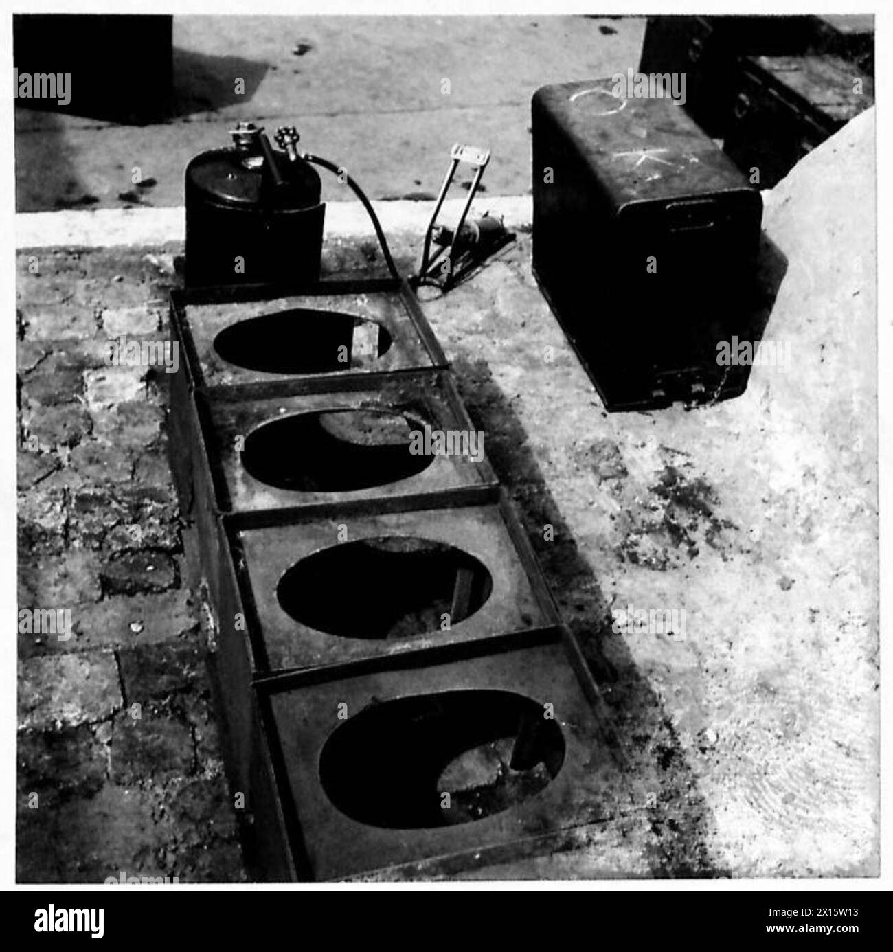 Improvised cooking ovens and boilers are in use at the depot for ...