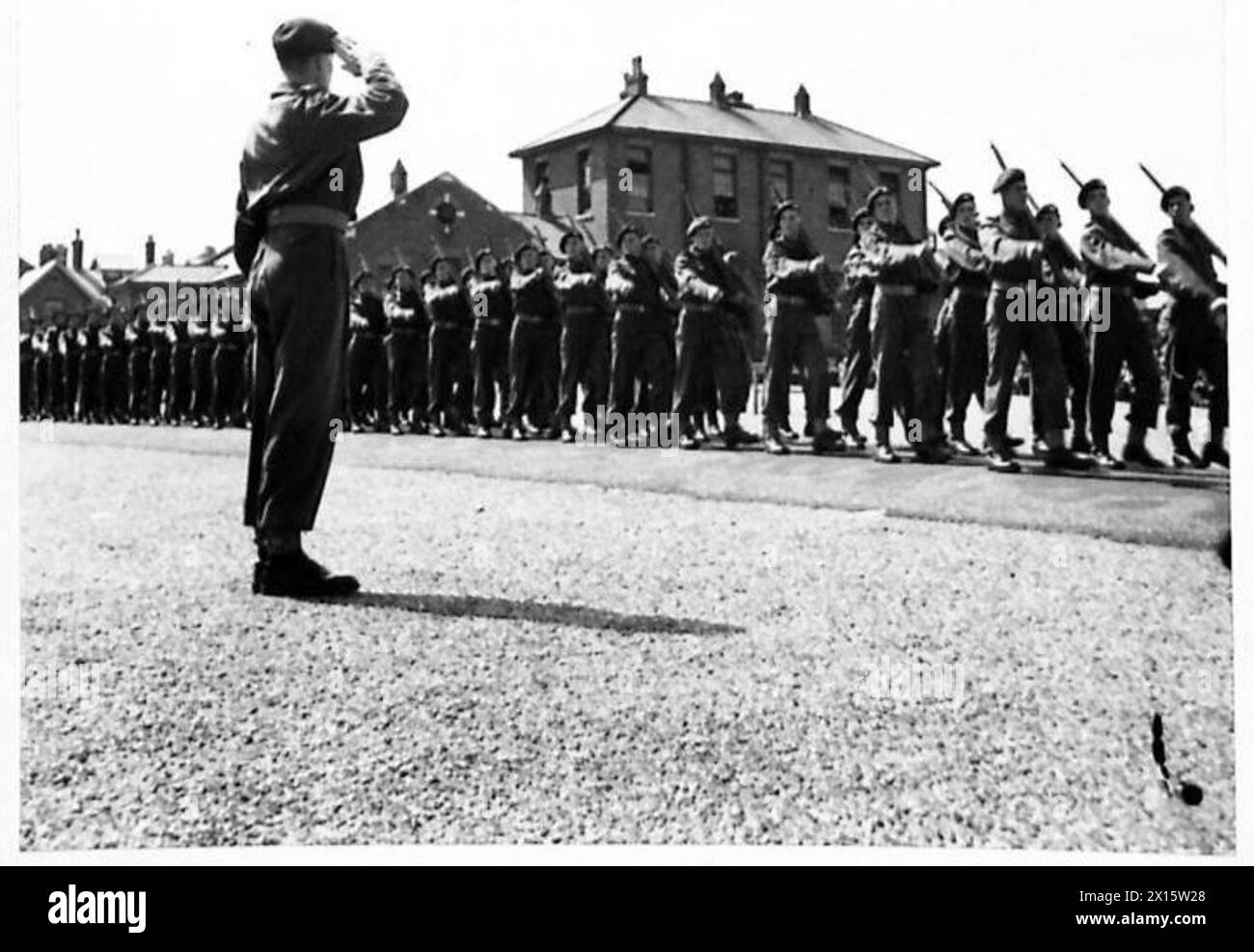 Brigadier S.J.L. Hill, DSO, MC, takes the salute at the passing out ...
