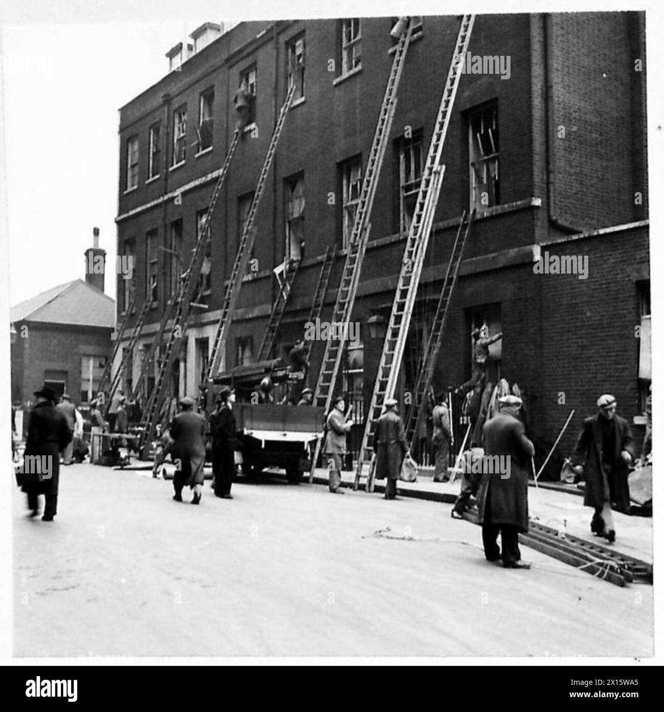 Photograph showing first-aid repair operations following an air raid ...
