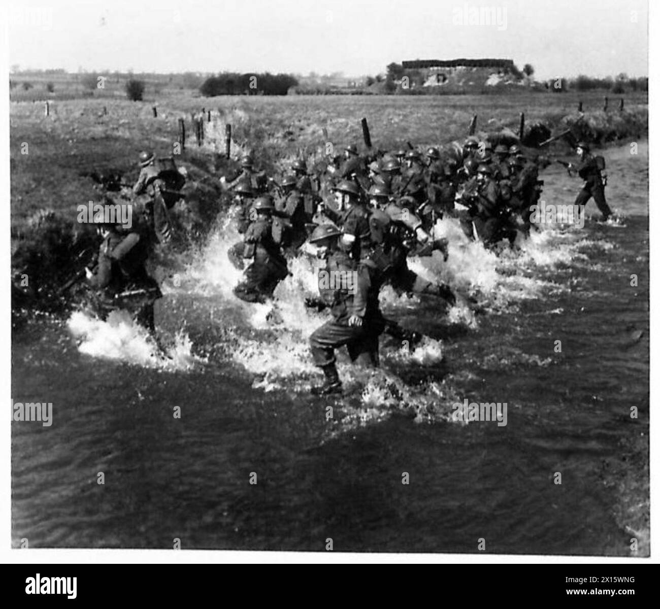Infantry soldiers perform a cross-country run as part of their training ...