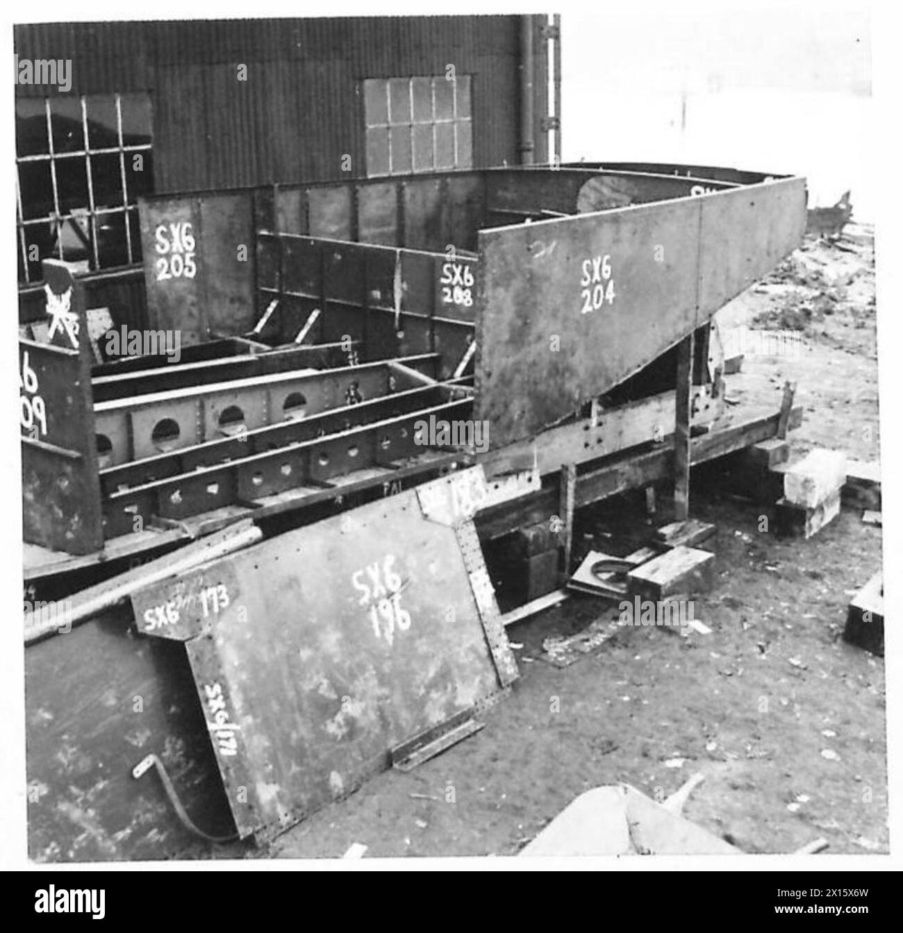 Royal Engineers assemble a 60-foot barge, showing aft section, plating ...