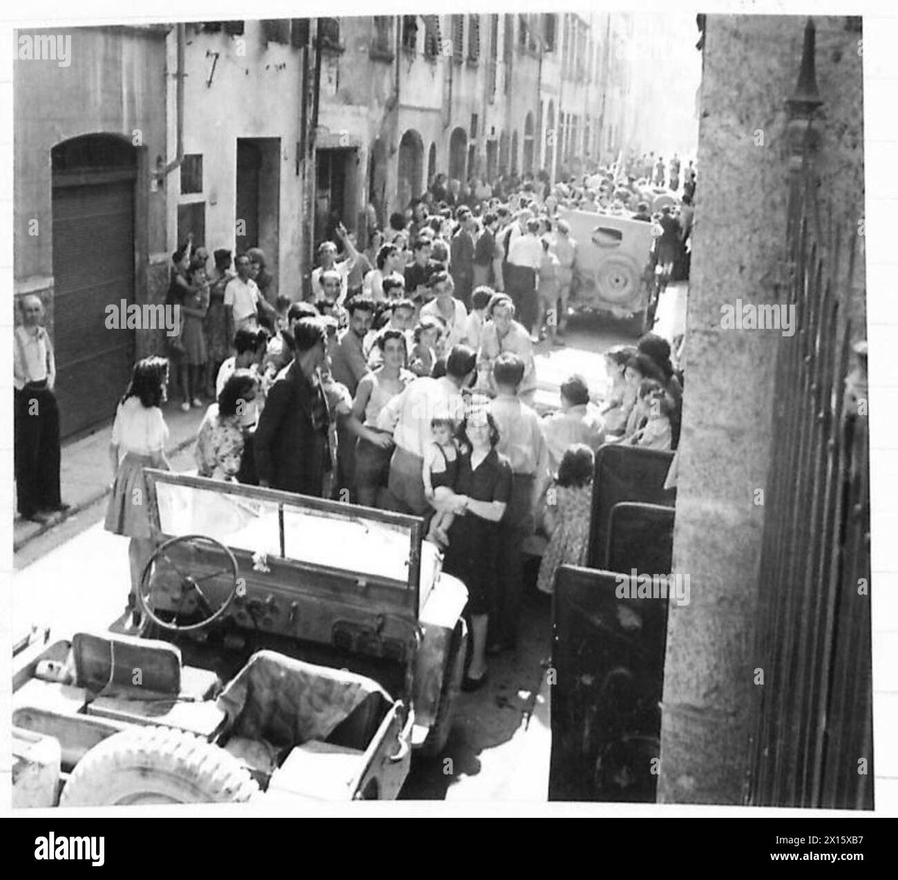 EIGHTH ARMY : ENTRY INTO FLORENCE - Civilians crowd round a jeep halted ...