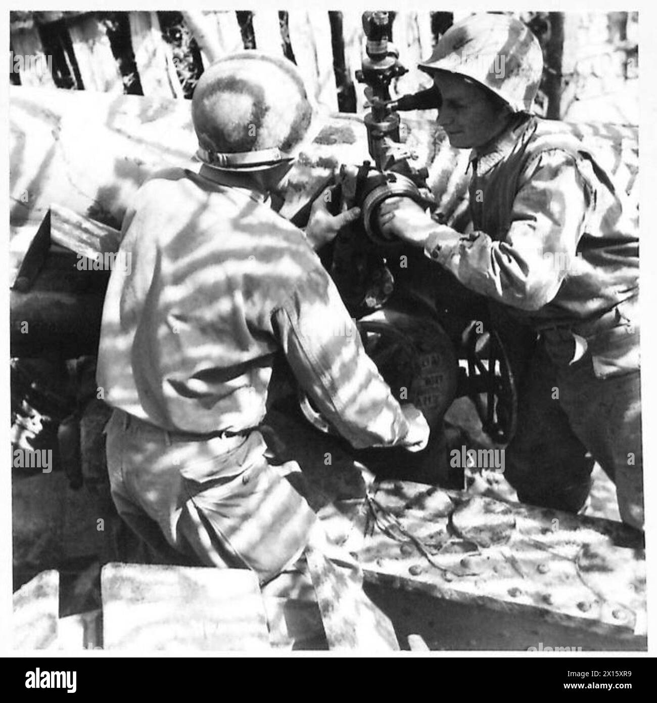 French naval gunners of the Fifth Army operate sighting equipment while ...