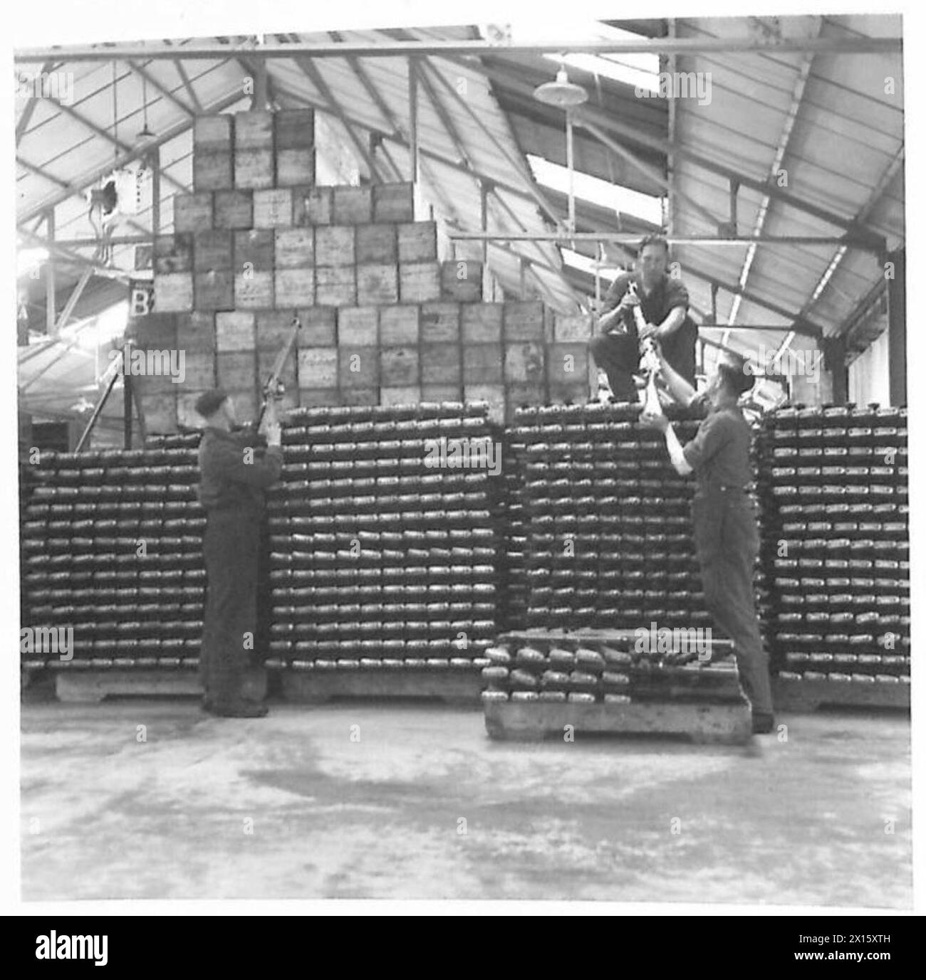 Thousands of No. 4 Mk.I small arms rifles are prepared for issue to ...
