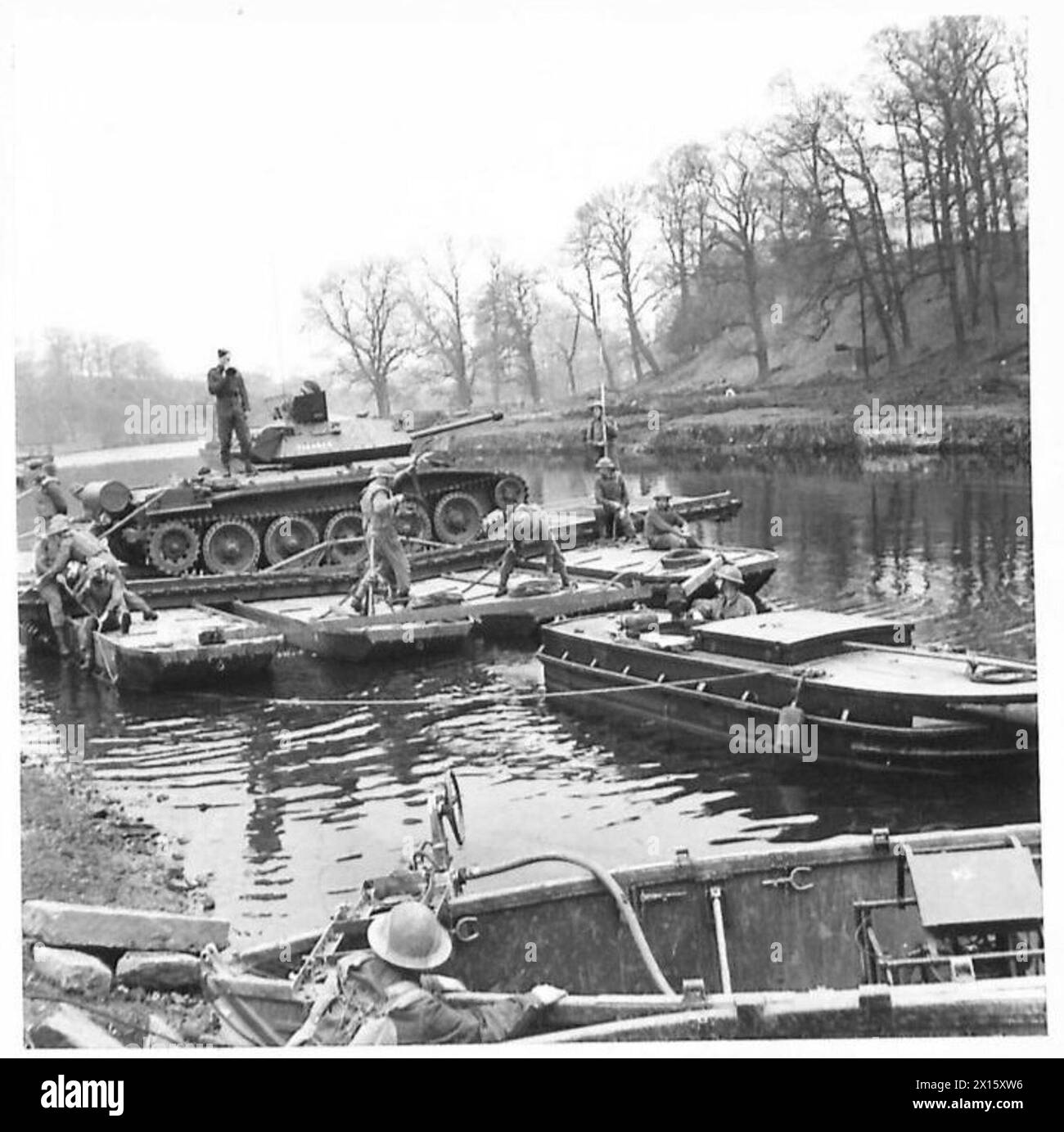 A Crusader tank is loaded onto a shore loading raft and ferried across ...