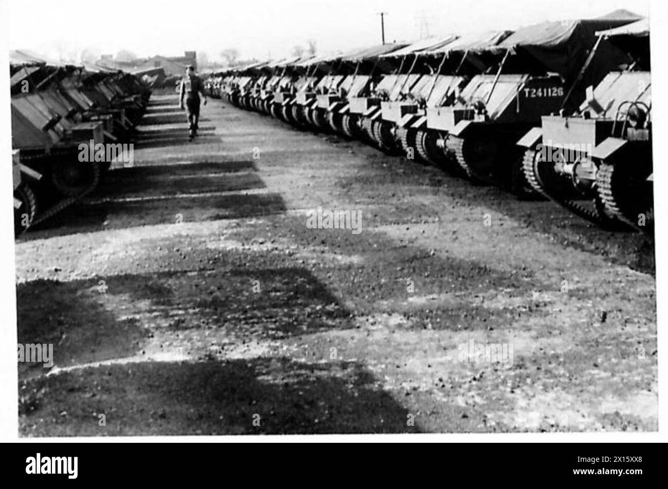 Lloyd carriers are parked at an Ordnance Depot in England, illustrating ...
