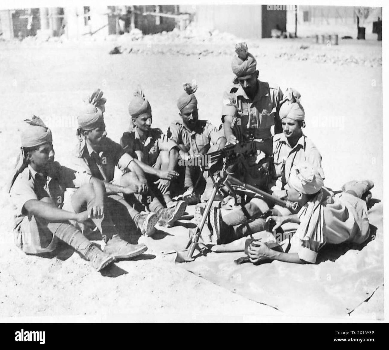 Indian troops at a base depot receiving instructions on operating an ...