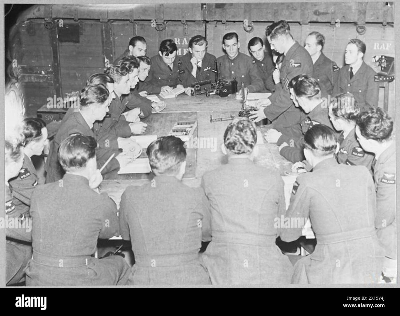 Polish airmen receive ground instruction on bomb-aiming procedures at ...