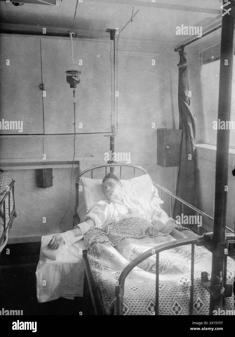BLOOD TRANSFUSION ABOARD A NAVAL HOSPITAL SHIP. 15 JULY 1943, SCAPA ...