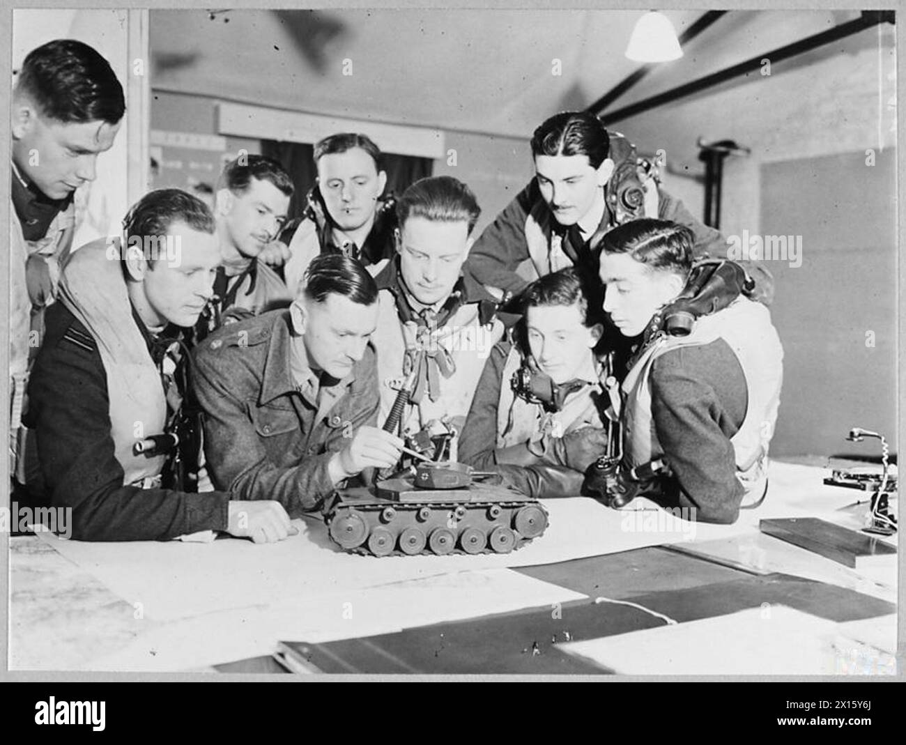 Major Bob Miller of 34 (Recce) Wing instructs No. 268 Squadron pilots ...