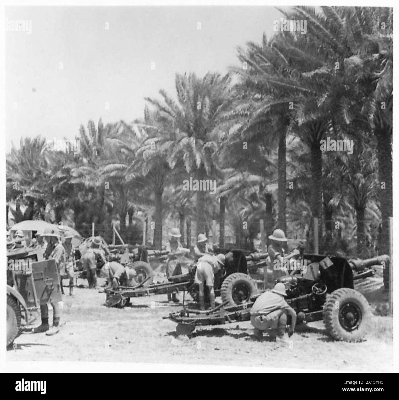 British Army gunners clean their weapons on arrival in Baghdad ...