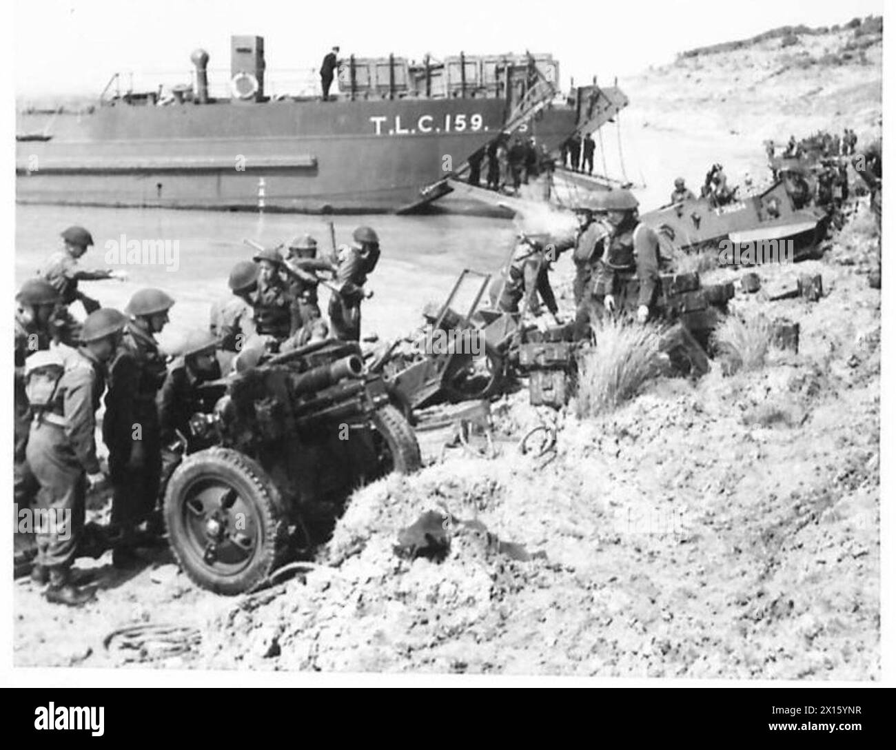 Troops, guns, ammunition, and Bren carriers disembark from tank landing ...