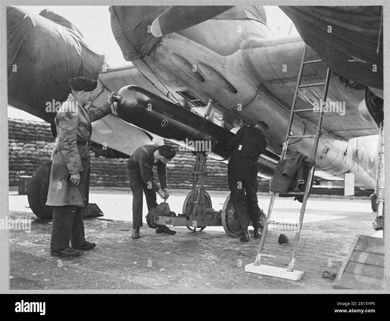 Ground crews load torpedoes onto Beaufighter aircraft for surprise ...