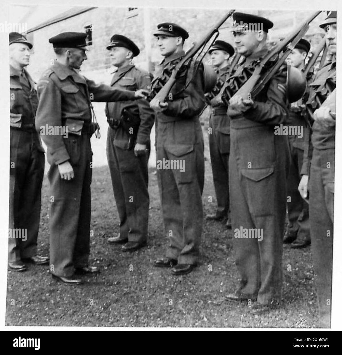 HOME GUARD MOTOR BOAT PATROL - Home Guards board a vessel in harbour ...