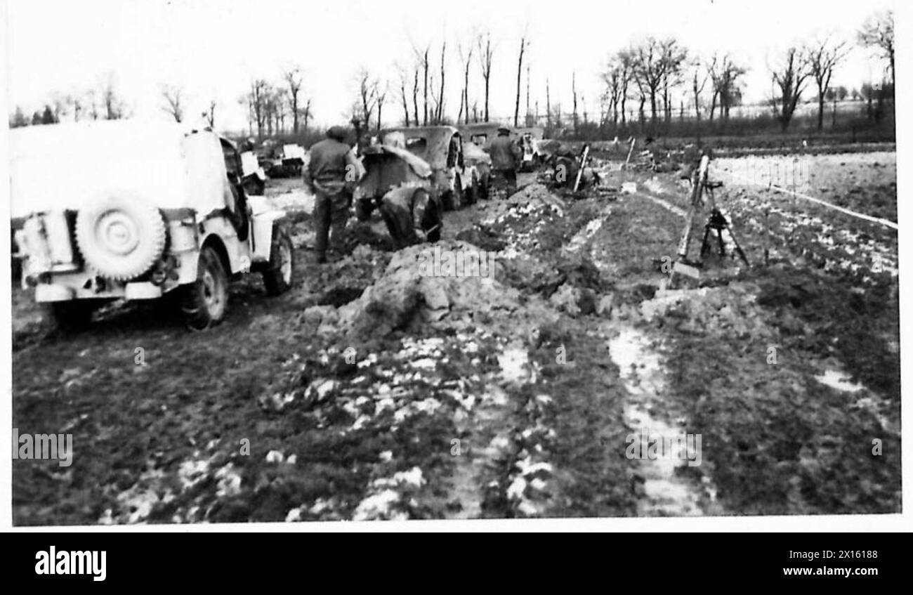 12 CORPS ADVANCE - Men of the 6th Cameronians advancing through mud and ...