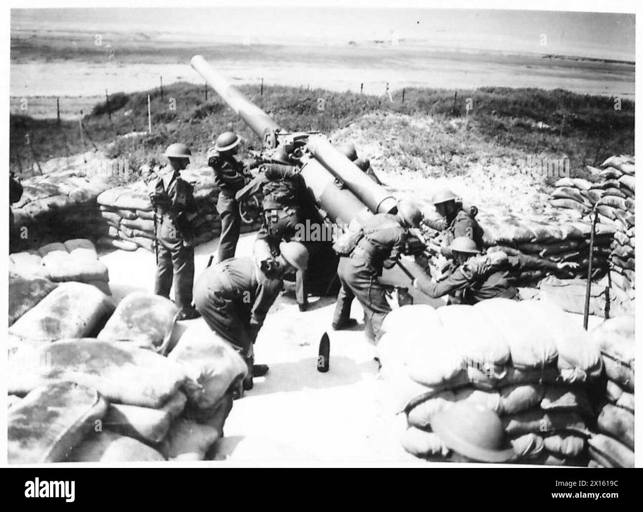 BRITAIN S DEFENCES - A four inch gun being fired British Army Stock ...