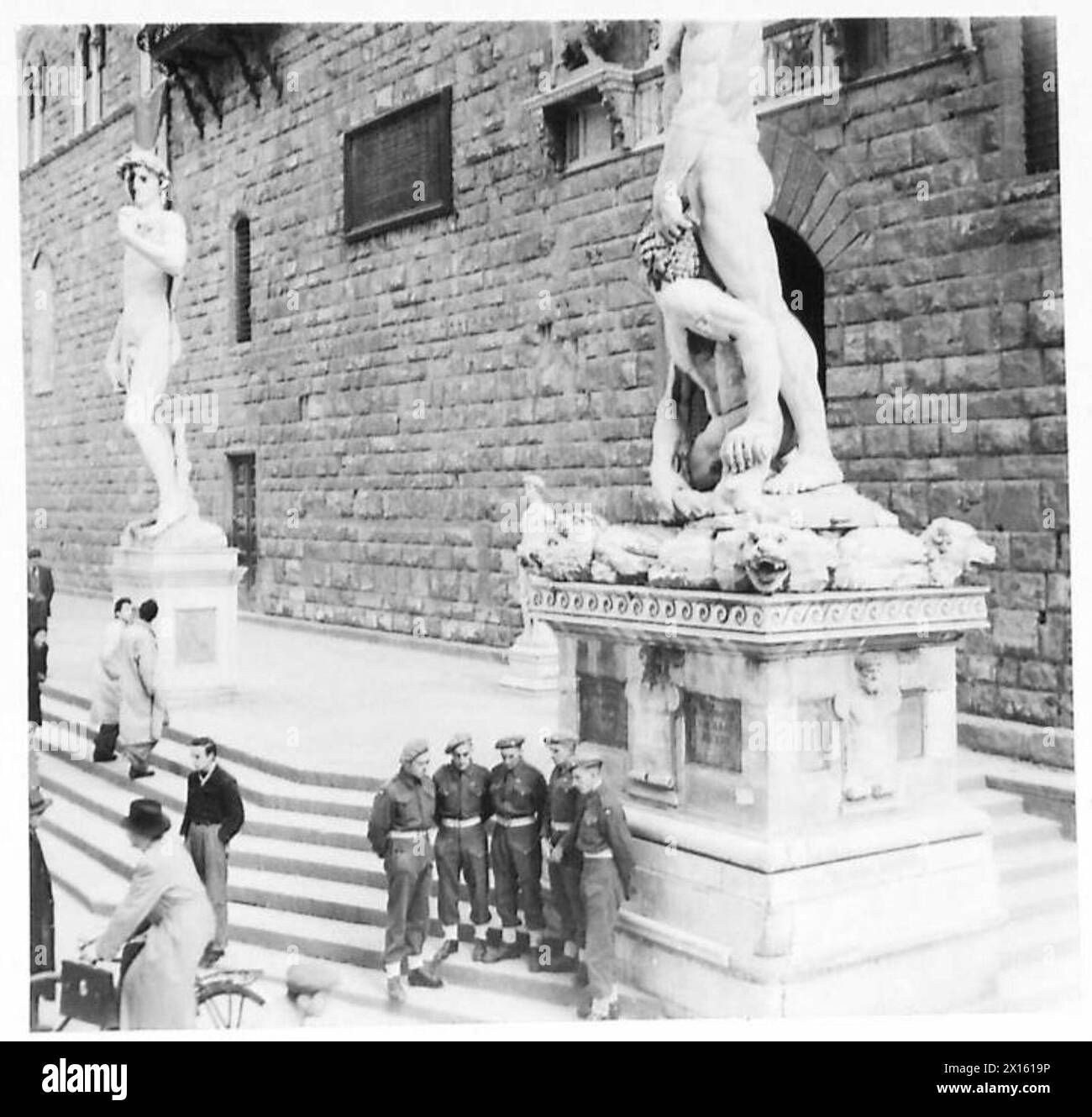 Small groups of British troops in Florence observe a two-minute silence beneath Michelangelo ...