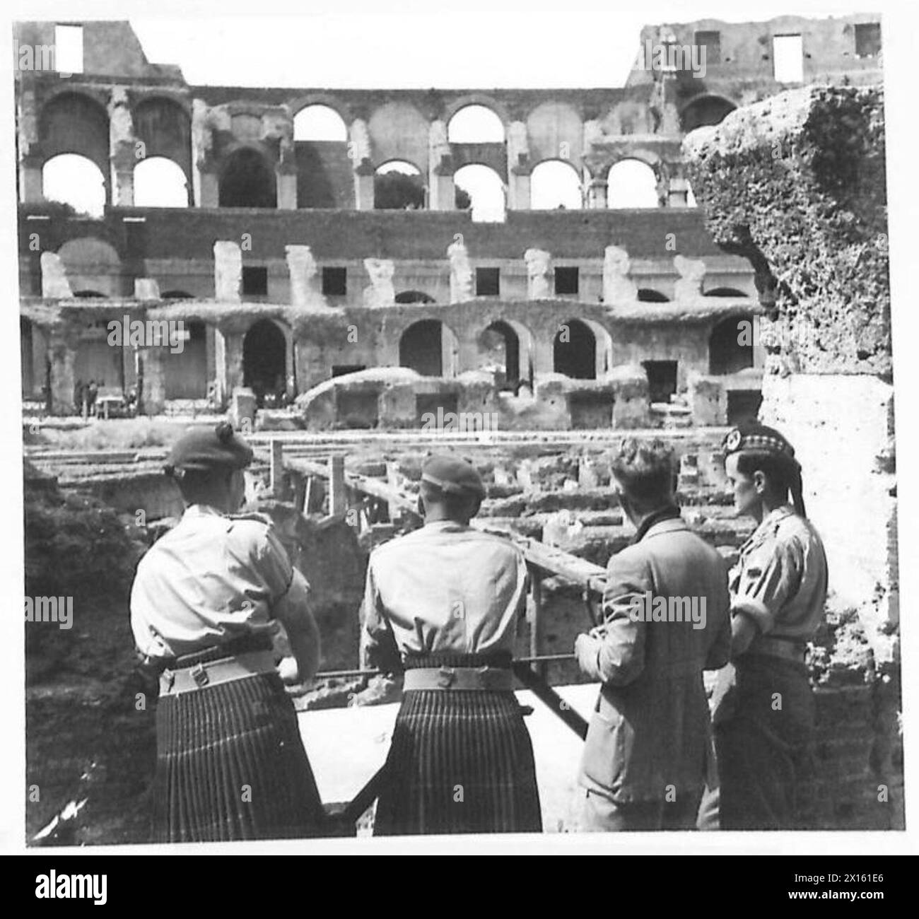 Personnel examine a segment of a Roman pillar that once supported the ...