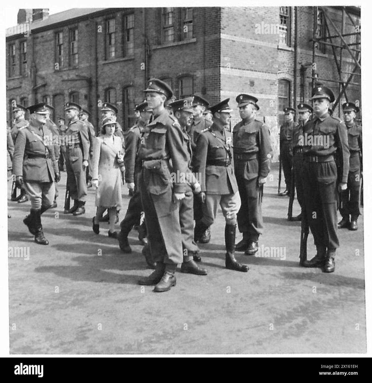 Princess Elizabeth and the King inspect Guards troops by walking along ...