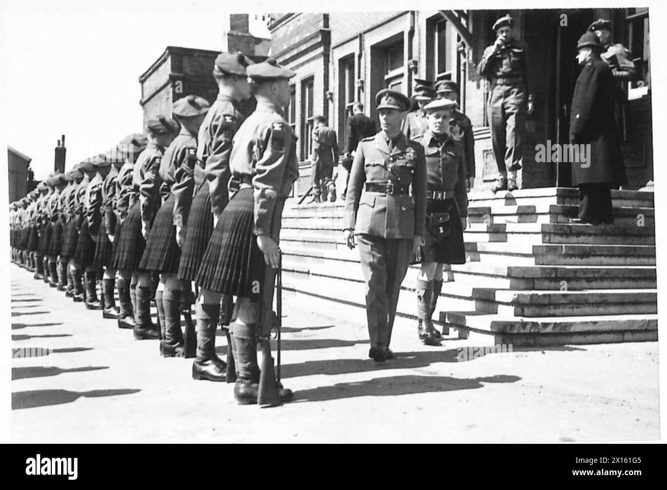 The King inspects invasion troops with the Tyneside Scottish Regiment ...