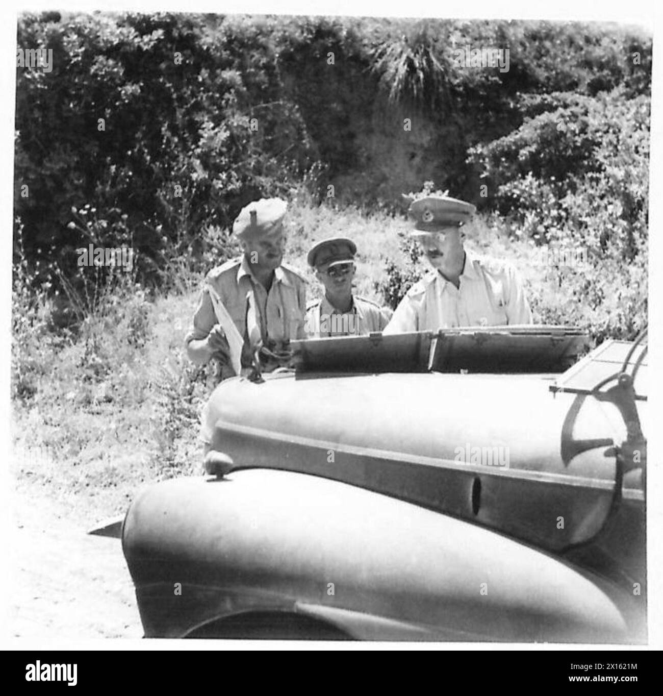 INVASION OF SICILY - Battle Conference. Left to right:- Brigadier ...