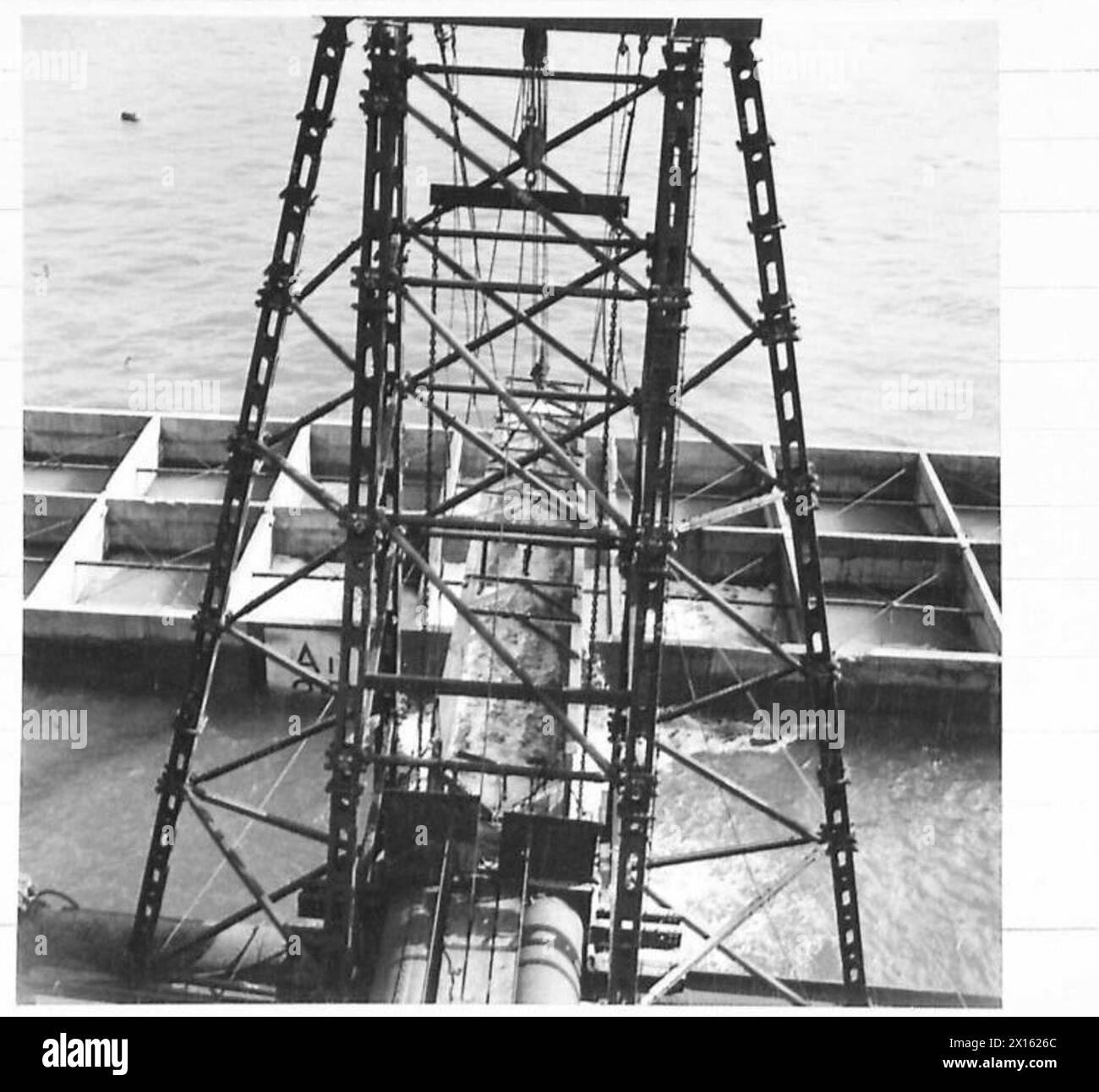 PHOTOGRAPHS OF PREFABRICATED PORT, ETC. - Breakwater unit filled with ...