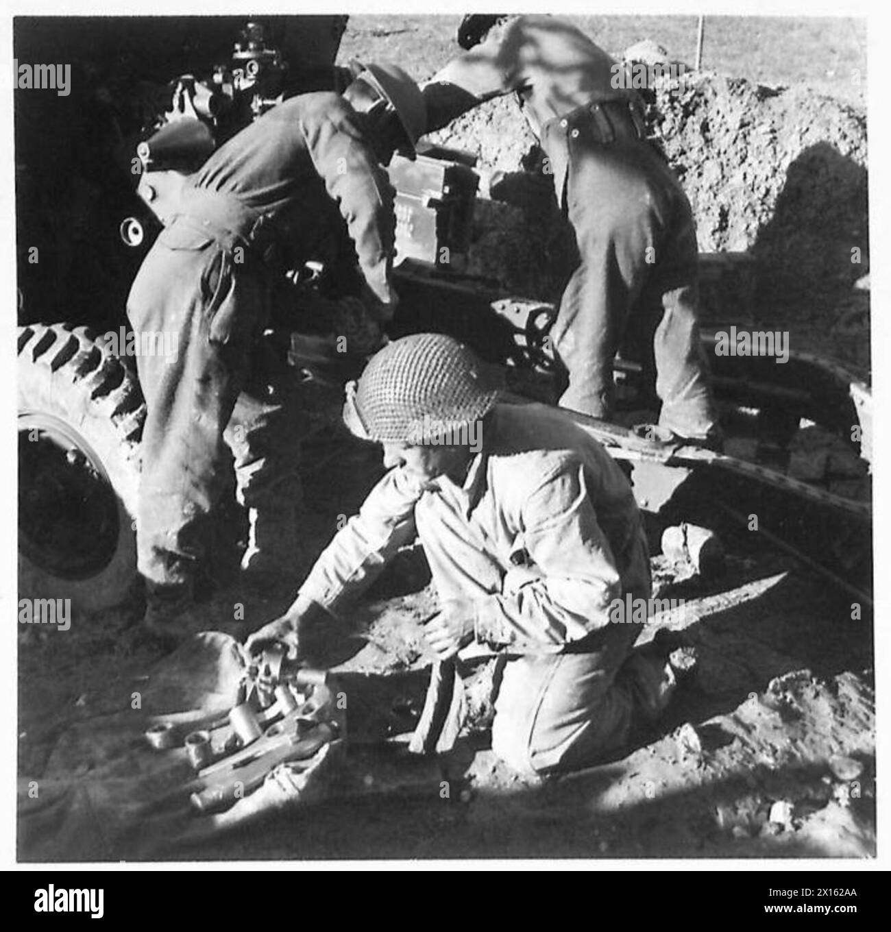 Gunners Goodram, Bunn, and Thomas of the British Eighth Army clean the ...