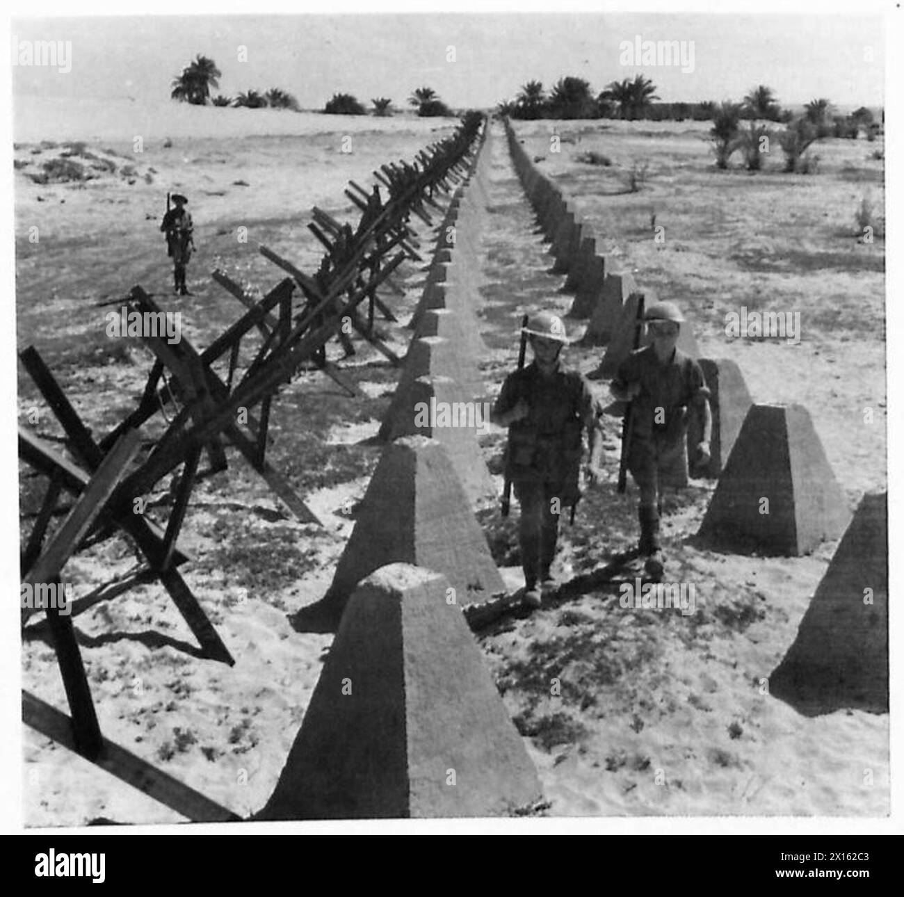 OFFICIAL PHOTOGRAPHS TAKEN IN THE WESTERN DESERT - Patrolling anti-tank ...