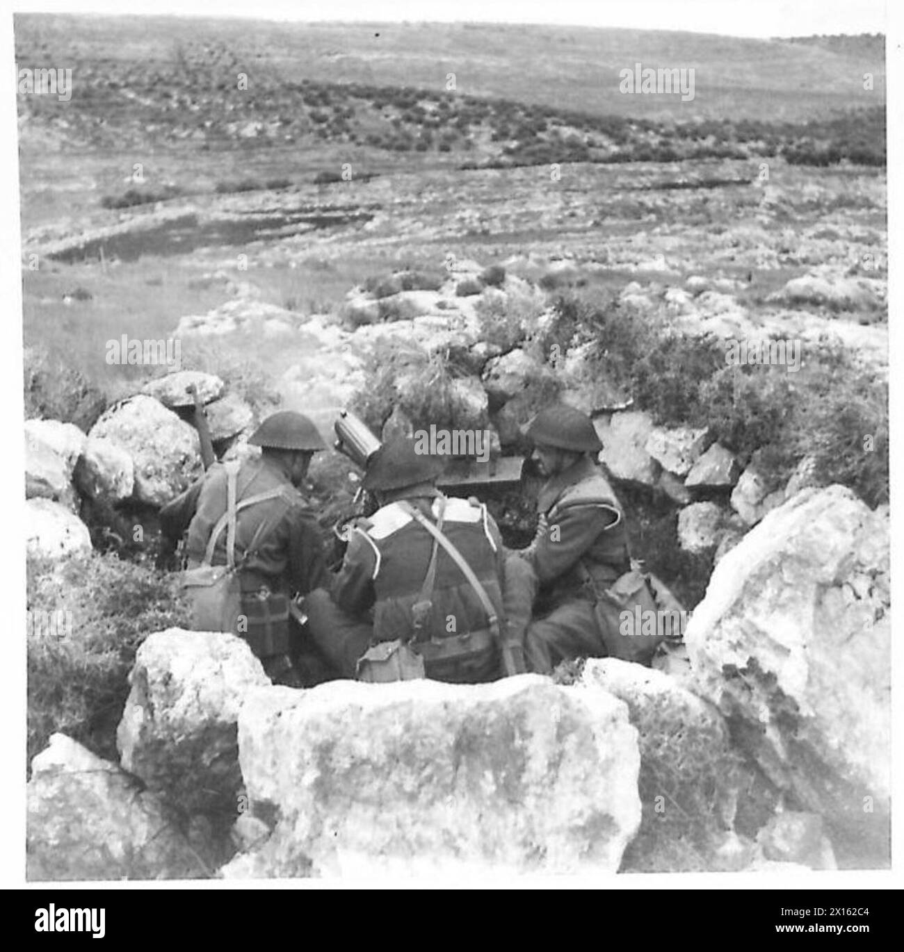 A Greek Army machine gun is operated in action during a training ...