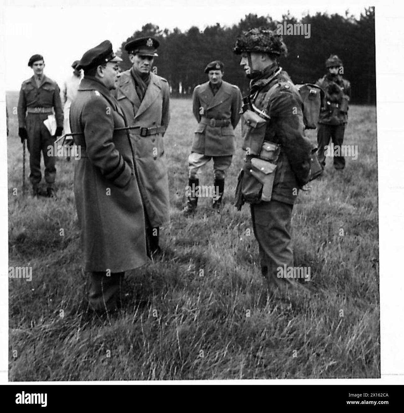 Lieutenant General Brereton inspects equipment with an Engineer officer ...