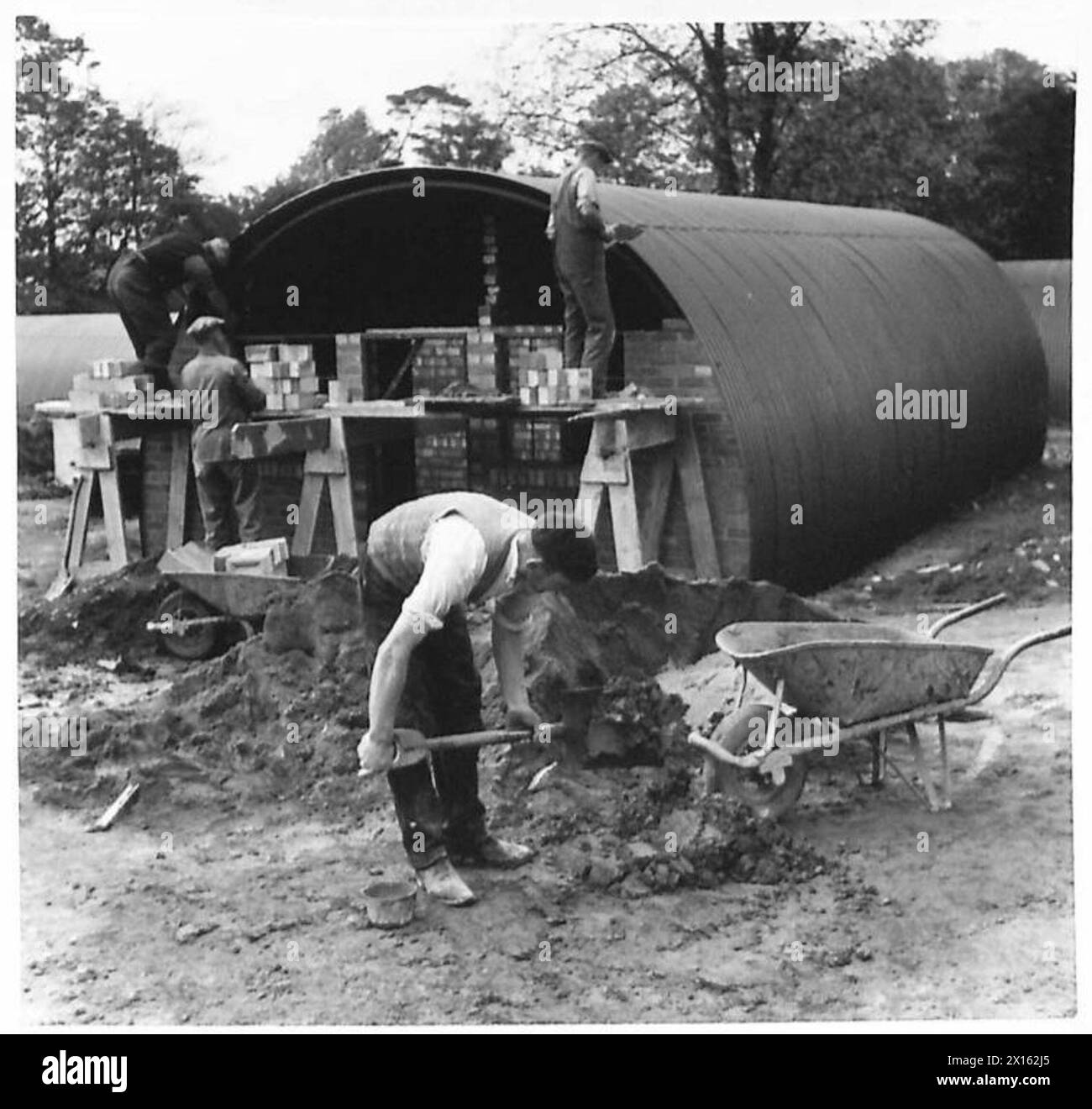 Construction work at a new British Army camp includes bricking the ends ...