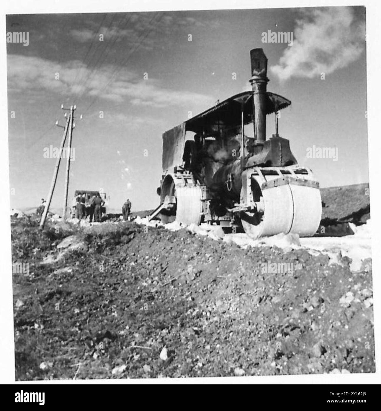 1ST PARACHUTE SQUADRON TAKES OVER - Fine gravel being rolled into the ...