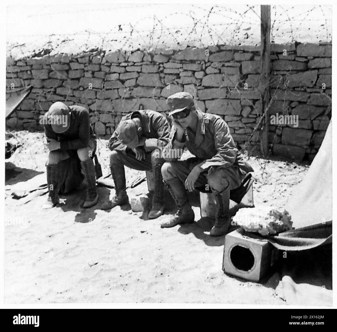 Three German prisoners appear dejected after their capture by British ...