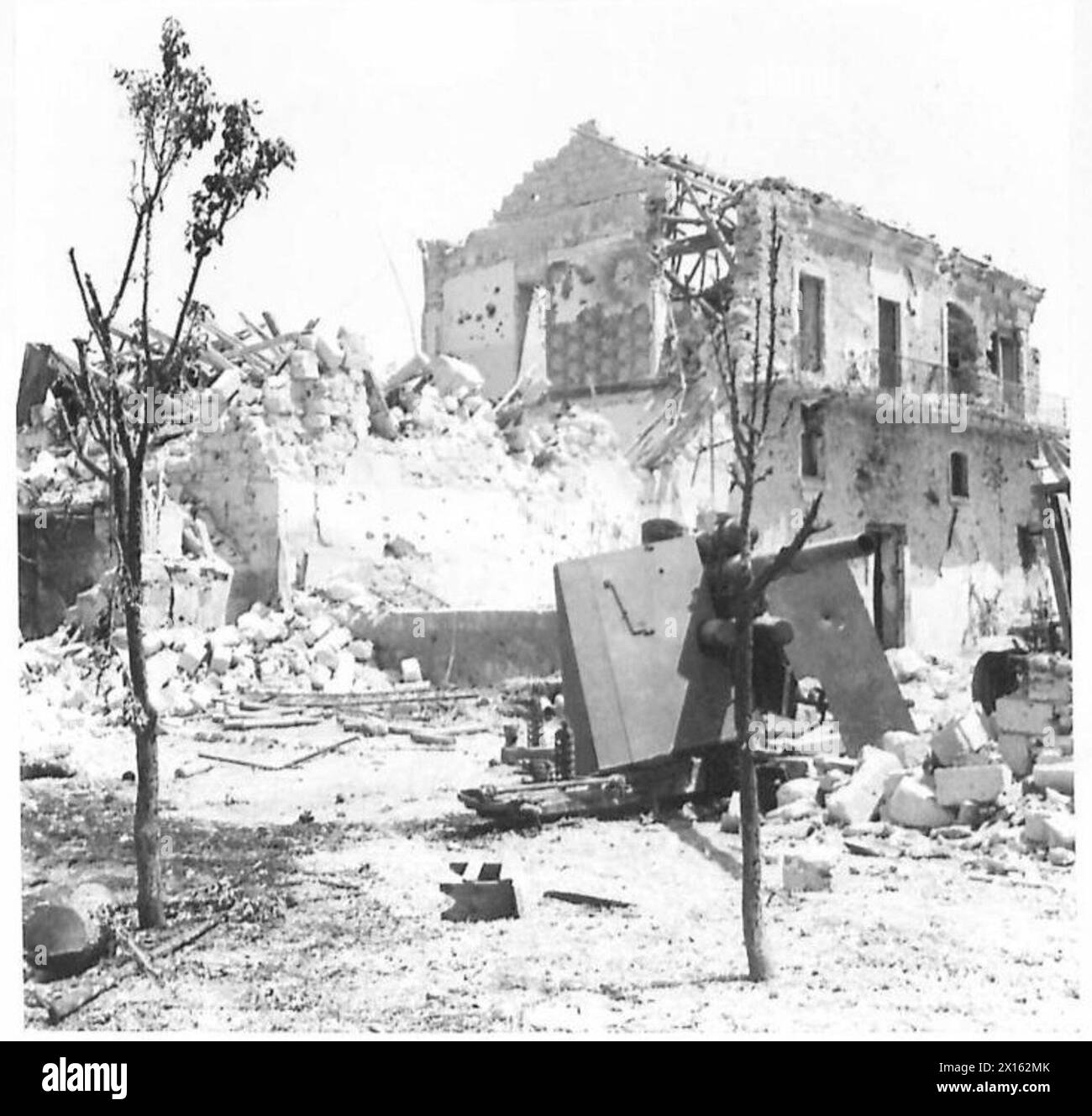 BATTLE OF GORNALUNGA BRIDGE - 88 mm German A/Tk gun beside the wreckage ...