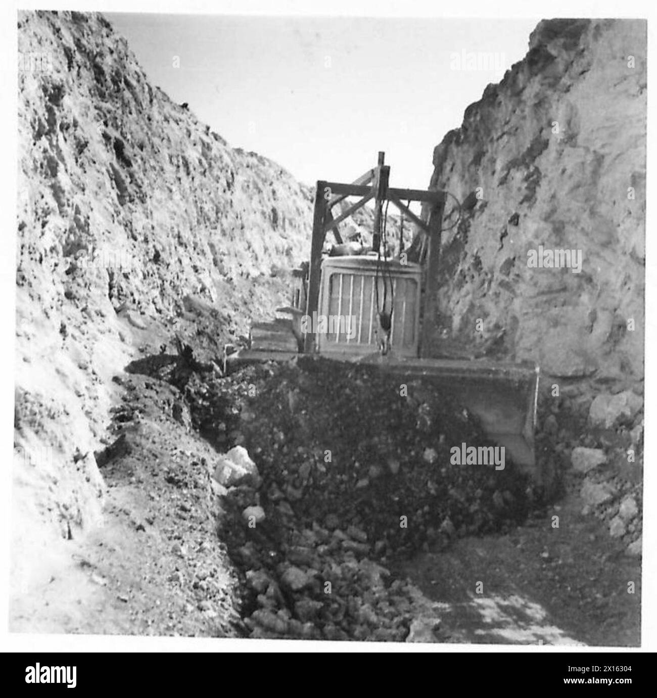 BUILDING THE HAIFA-TRIPOLI RAILWAY - A cutting beind made through the ...