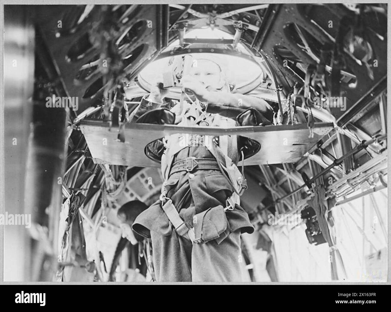 EMPIRE AID TO BRITAIN - This New Zealand air observer is "shooting" the ...