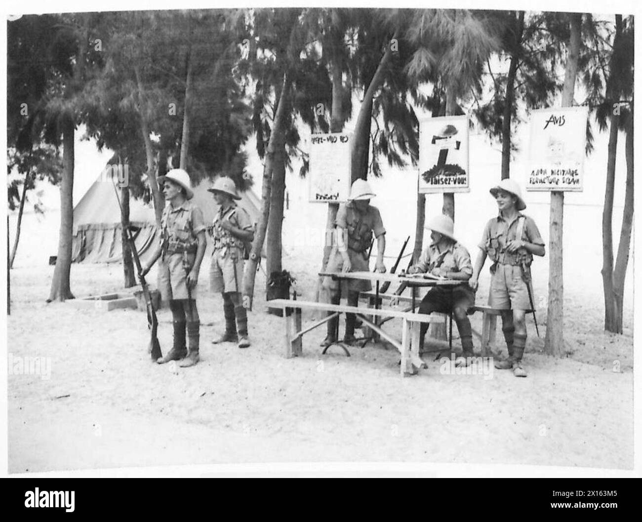 Photographs show a Free French Forces unit at the entrance to their ...