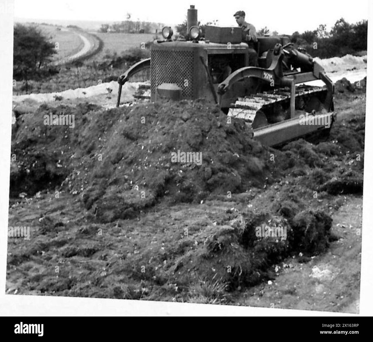 Bulldozer during road construction Black and White Stock Photos ...
