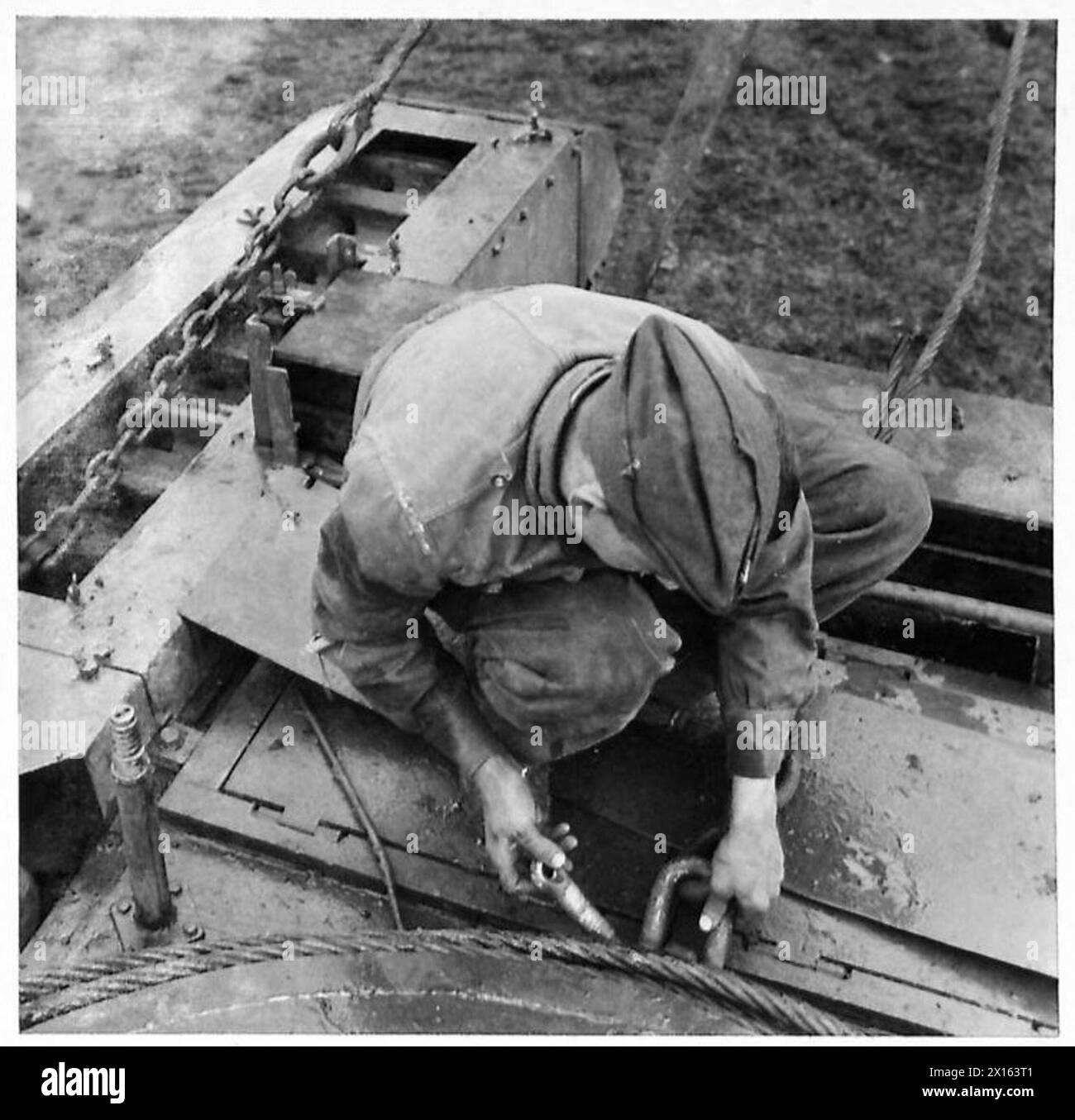 Personnel of the Experimental Tank Recovery Section at Aborfield attach ...