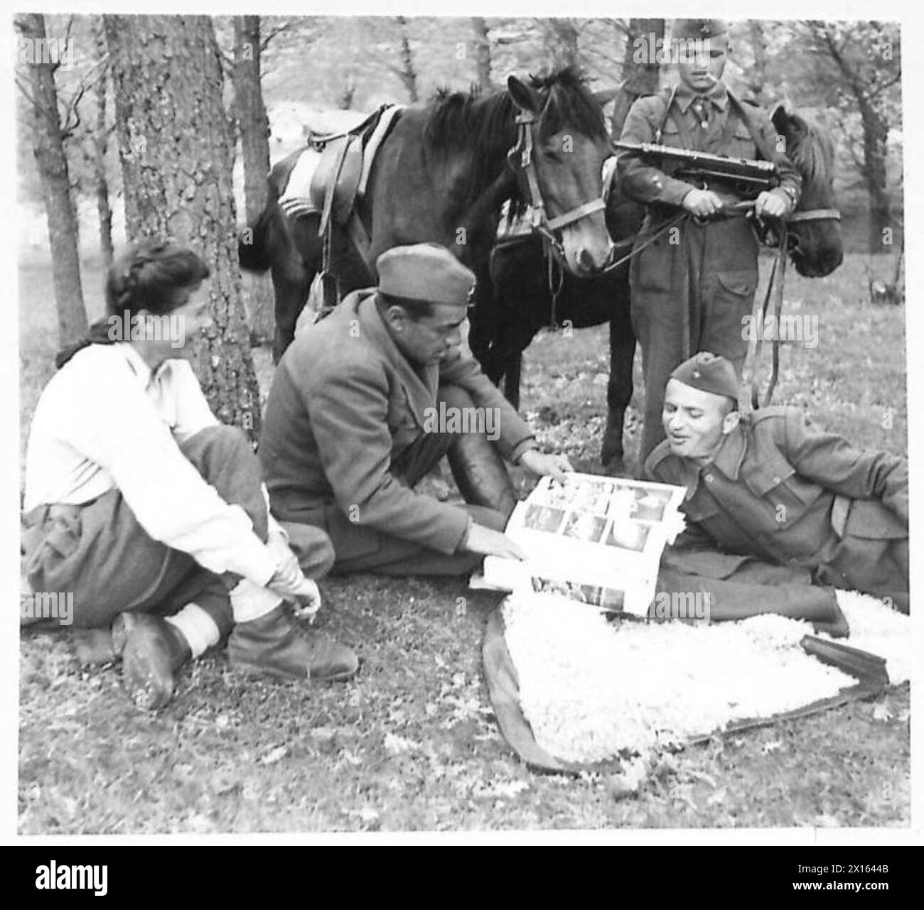 Dr. Vladimir Ribnikar talks to a Partisan officer while Madame Yara ...