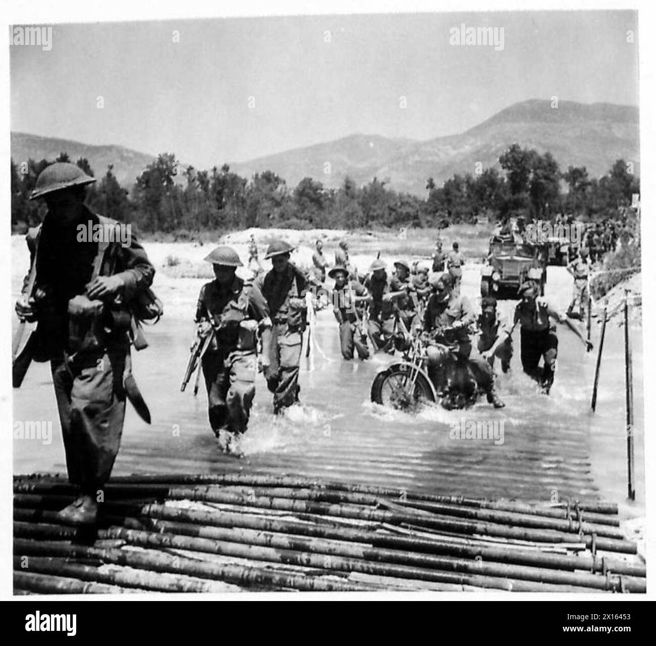 Infantry wade across the river Melfa after the bridge is destroyed ...