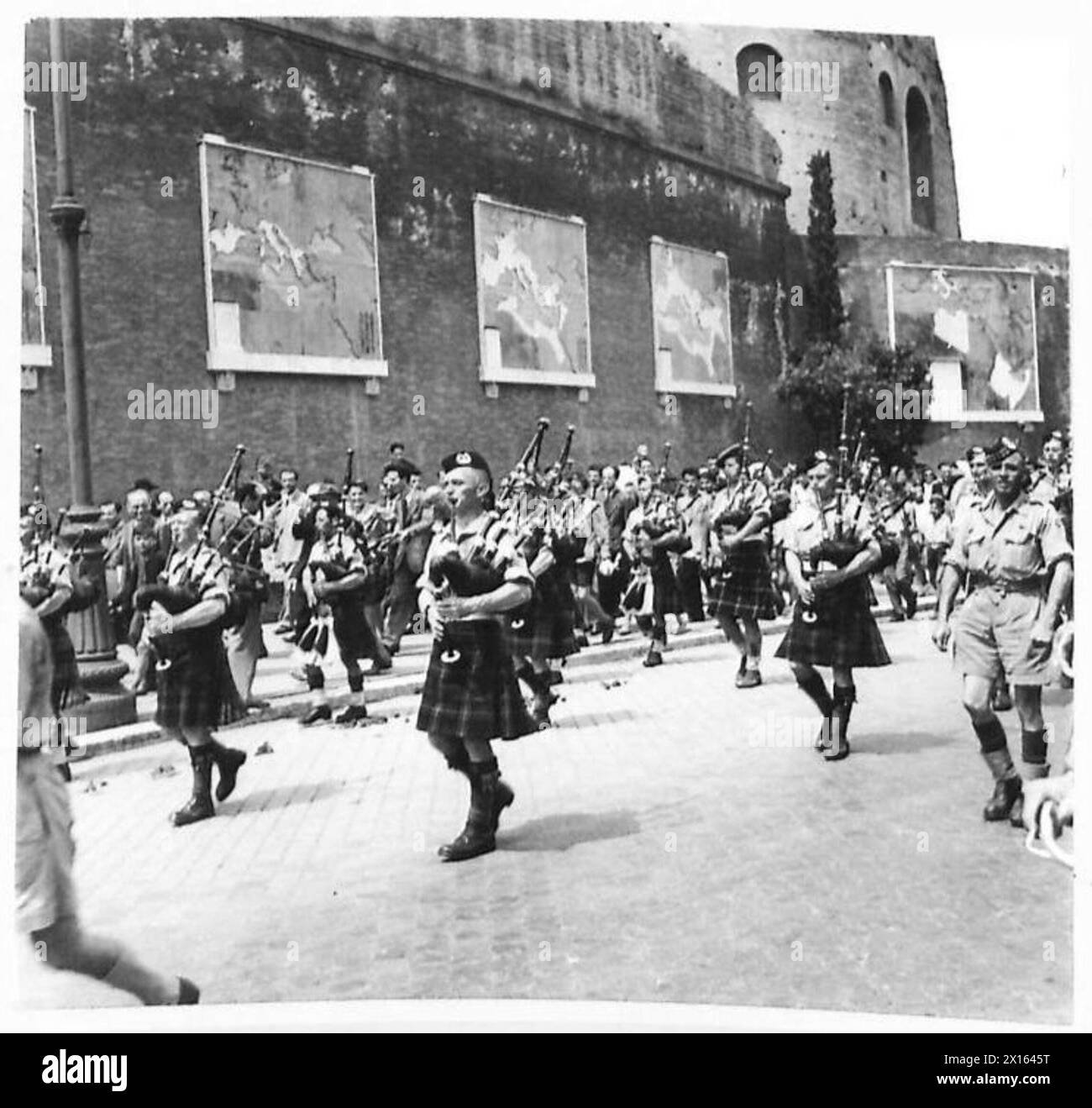 ROME - The pipe band marching through the Via Impero in the background ...