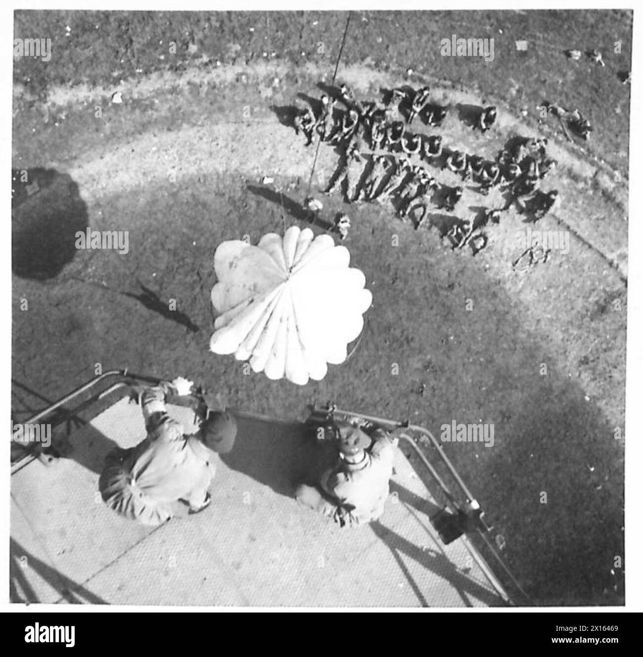 Trainees descend from the parachute tower at the Parachute Training ...
