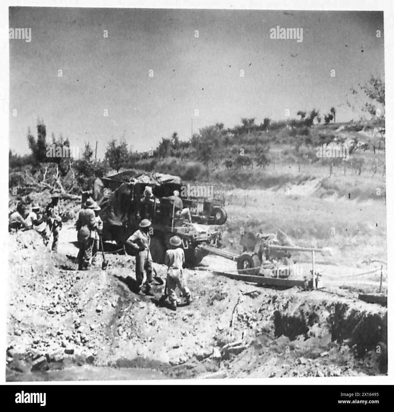 German forces leave heavy demolitions during retreat. A 6-pounder anti ...